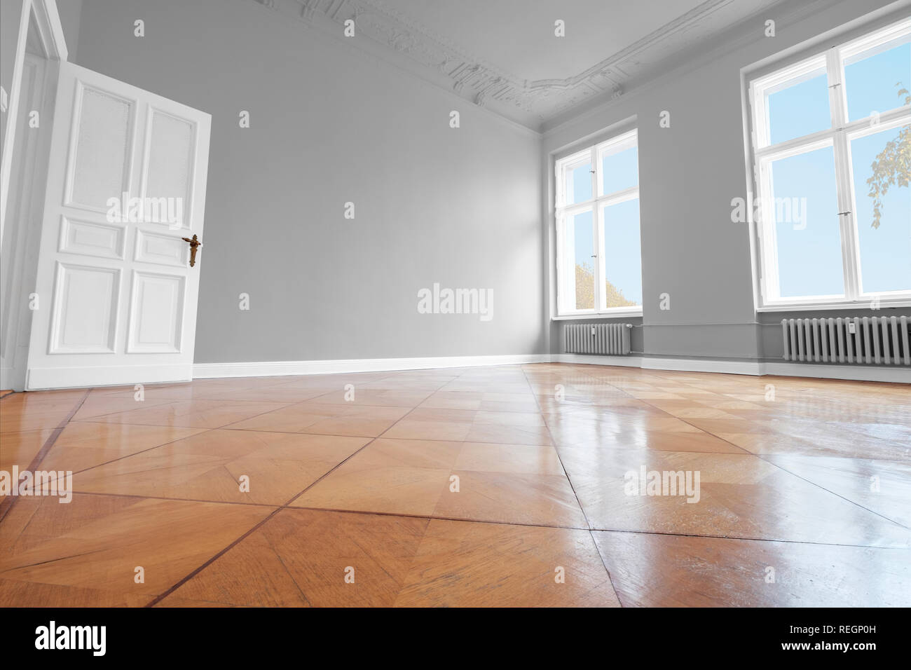 old building room after renovation with wooden floor - real estate ...