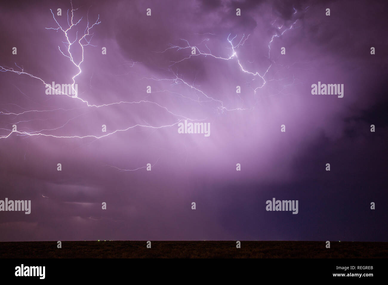 Cloud to cloud lightning streaks across a night sky during a ...