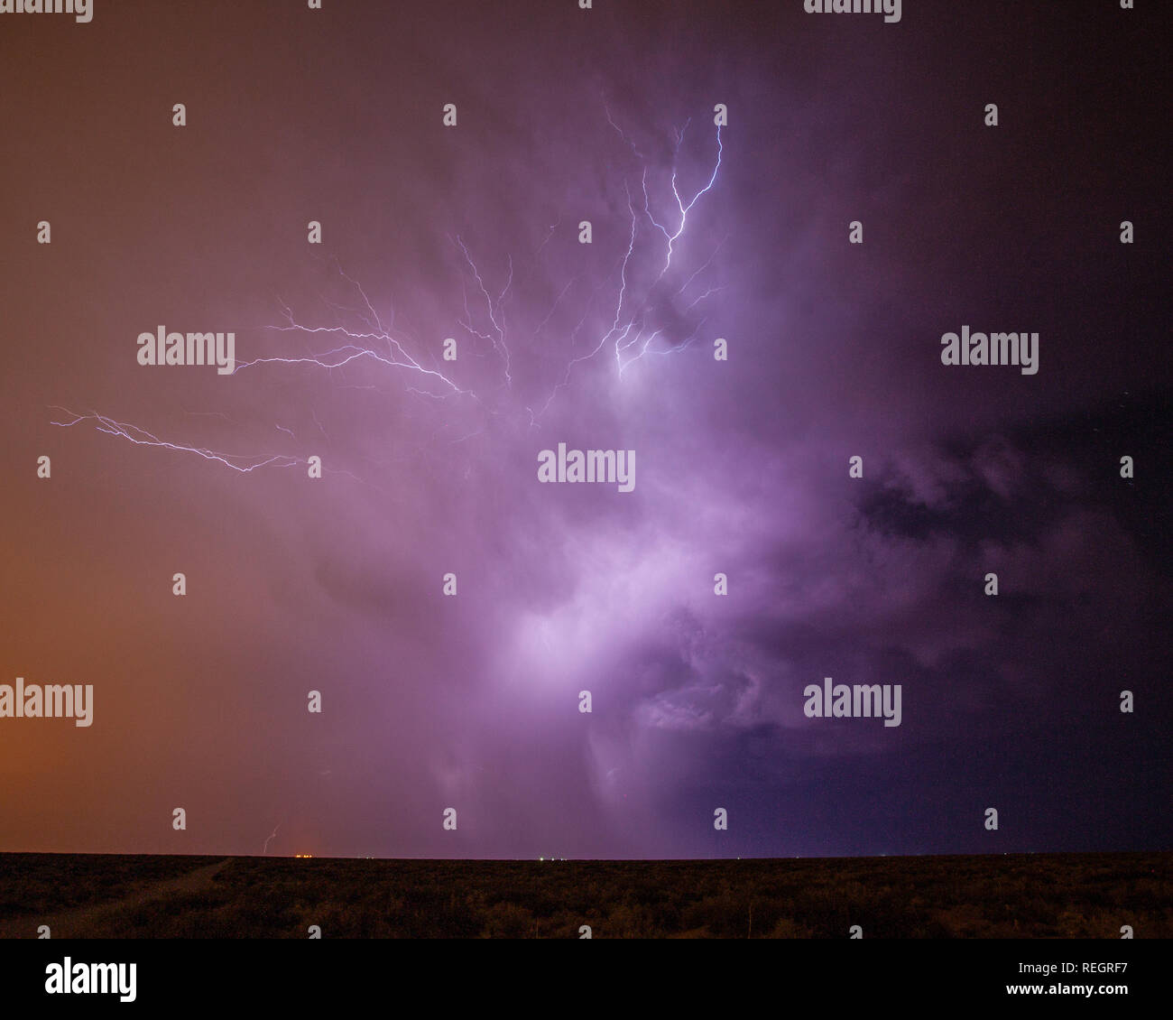 Cloud to cloud lightning streaks across a night sky during a ...