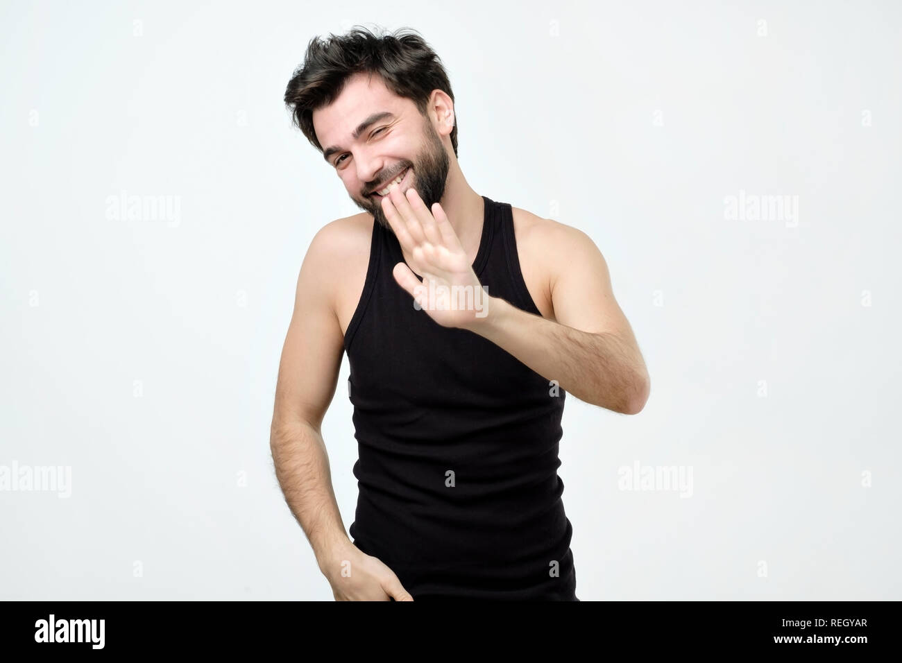 Guy dressed in black shirt showing stop gesture, asking to stop joking ...