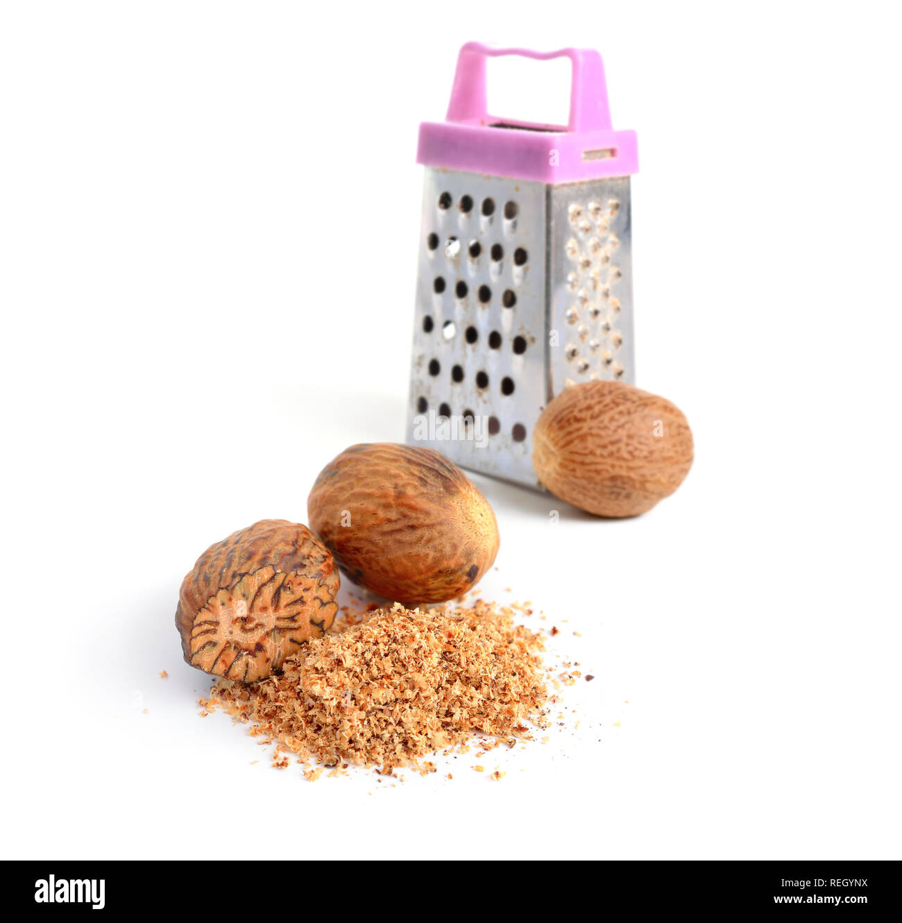 Nutmeg with little Grater. isolated on white background Stock Photo - Alamy