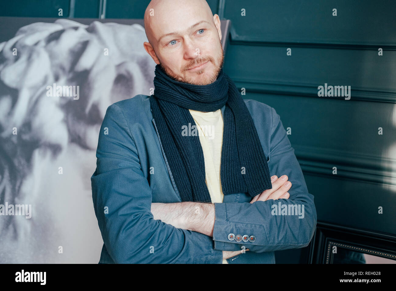 Portrait of attractive adult successful bald man art critic historian ...