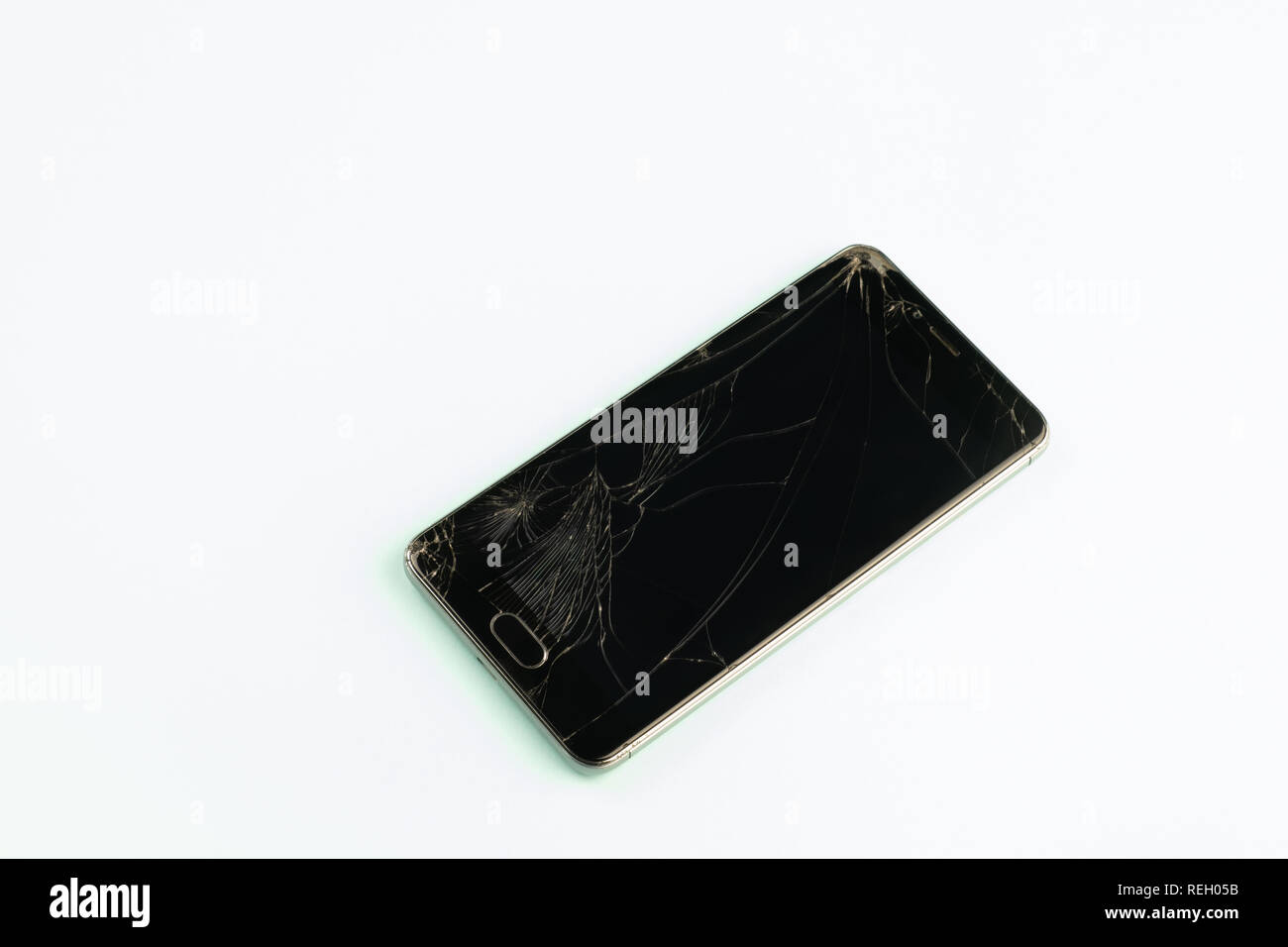 Mobile phone with broken black screen, top view. Distressed damaged ...