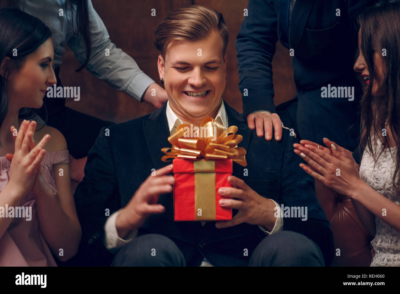 Man giving present birthday party hi-res stock photography and images ...