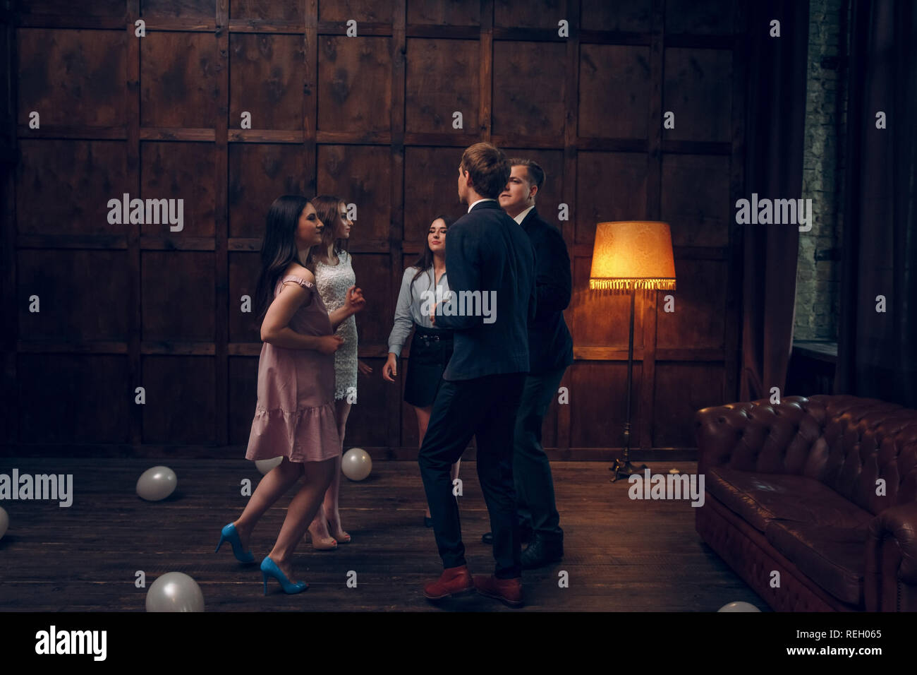 Group of friends dance at birthday party Stock Photo - Alamy