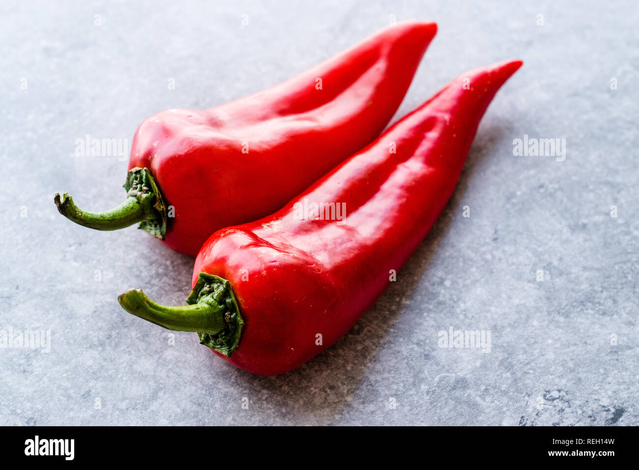 Raw Organic Fresh Red Chili Peppers on Blue Marble Surface. Organic ...