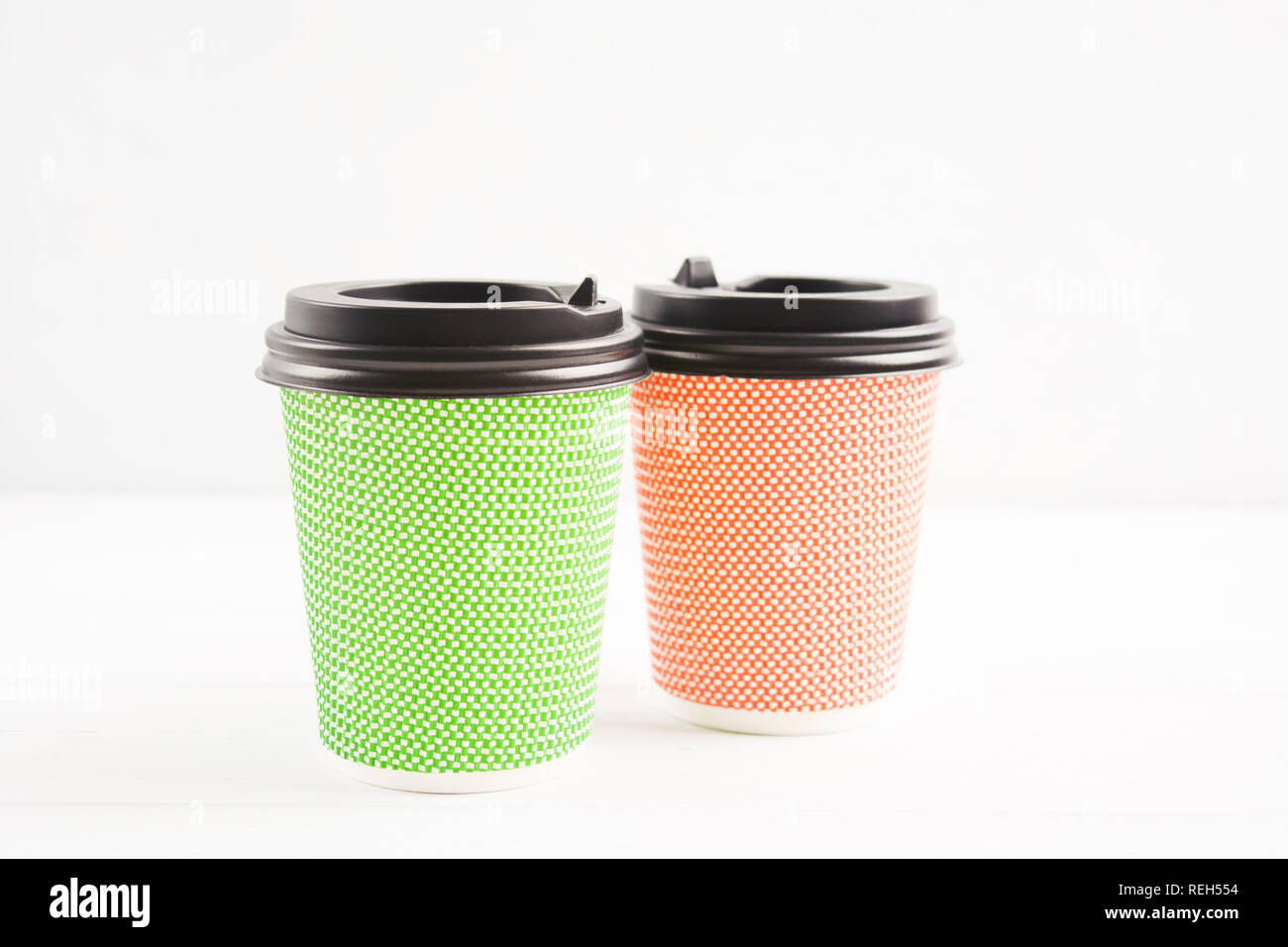 Two paper cups on white background, green and red cups with drink Stock ...