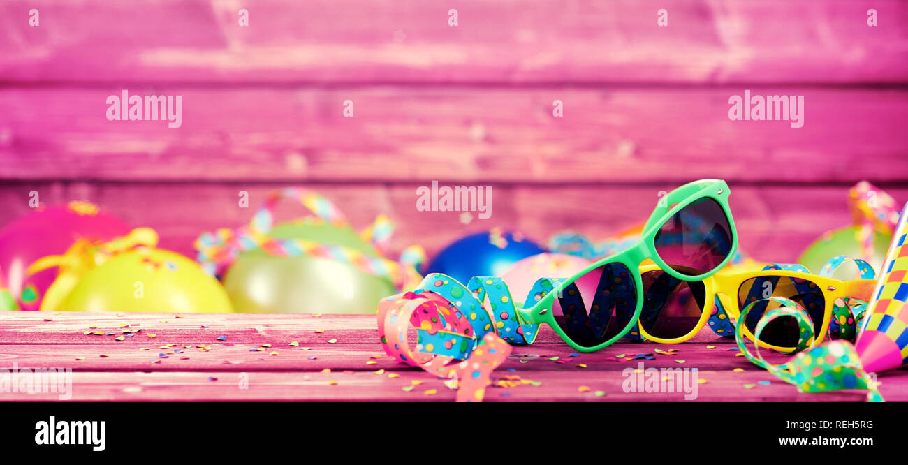 Fun party panorama background on vibrant pink wood with colorful ...