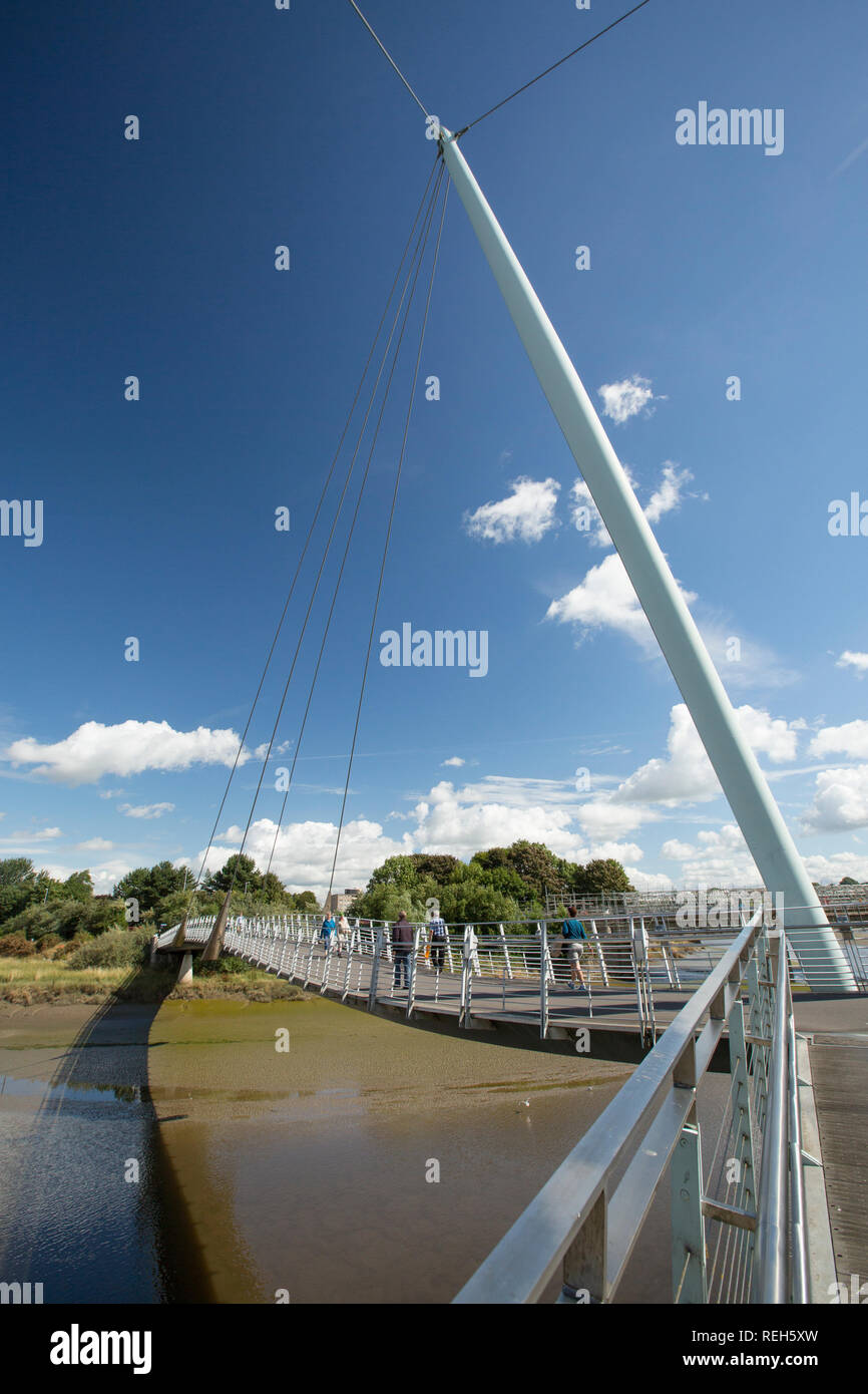 People crossing the Lune Millennium Bridge over the River Lune in ...