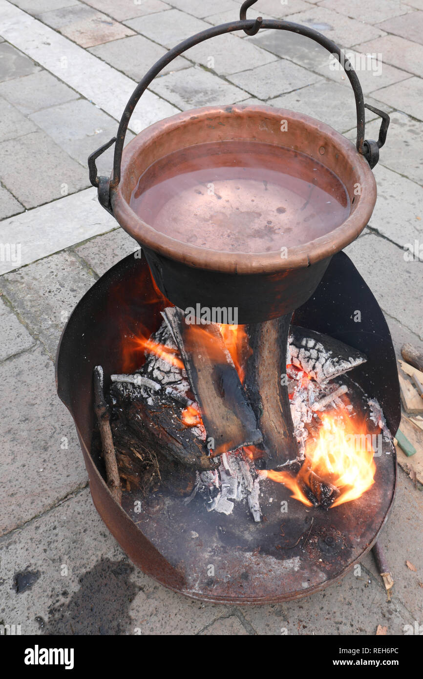 big copper cauldron full of water over the open fire Stock Photo - Alamy