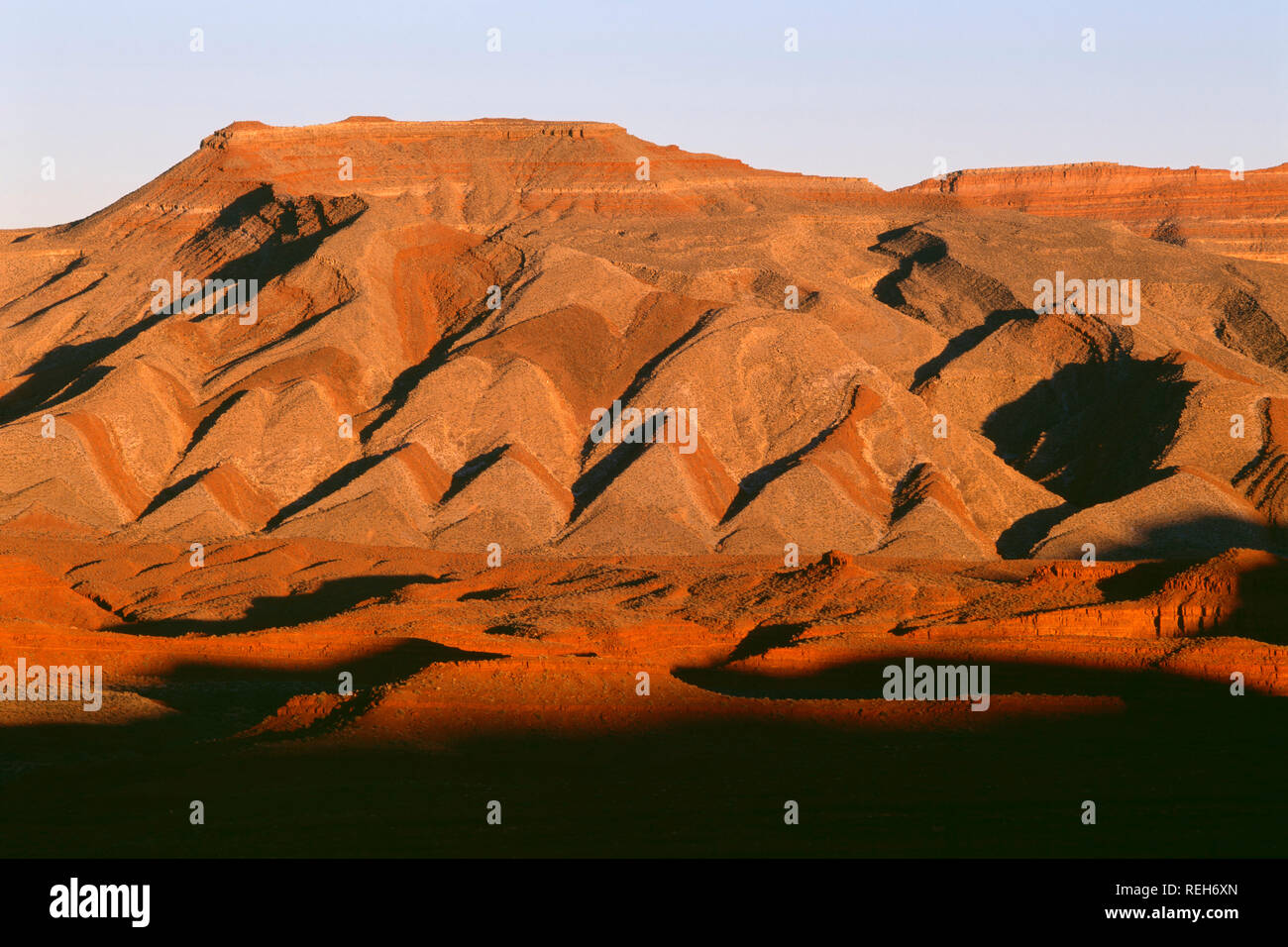 USA, Utah, San Juan County; Sunset reddens Raplee Ridge displaying ...