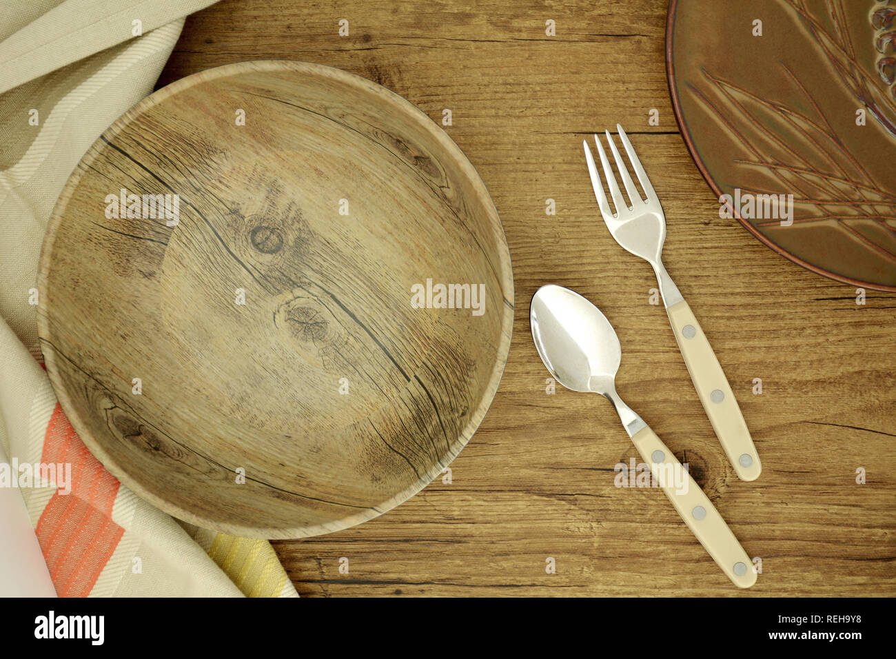 Rustic dishes on old wooden background with similar tones shot from ...