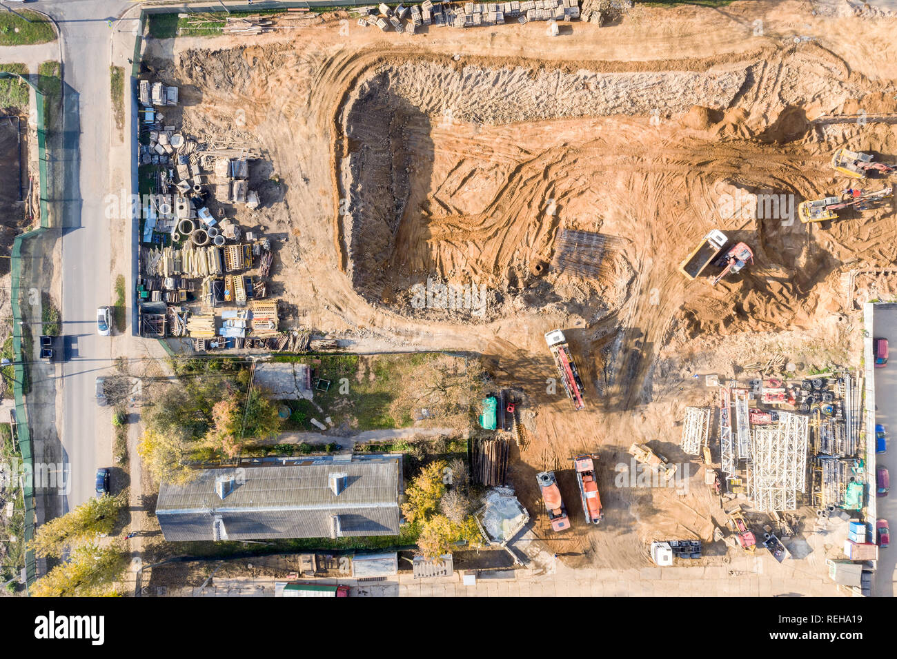 aerial photo of heavy building machinery working at city construction ...