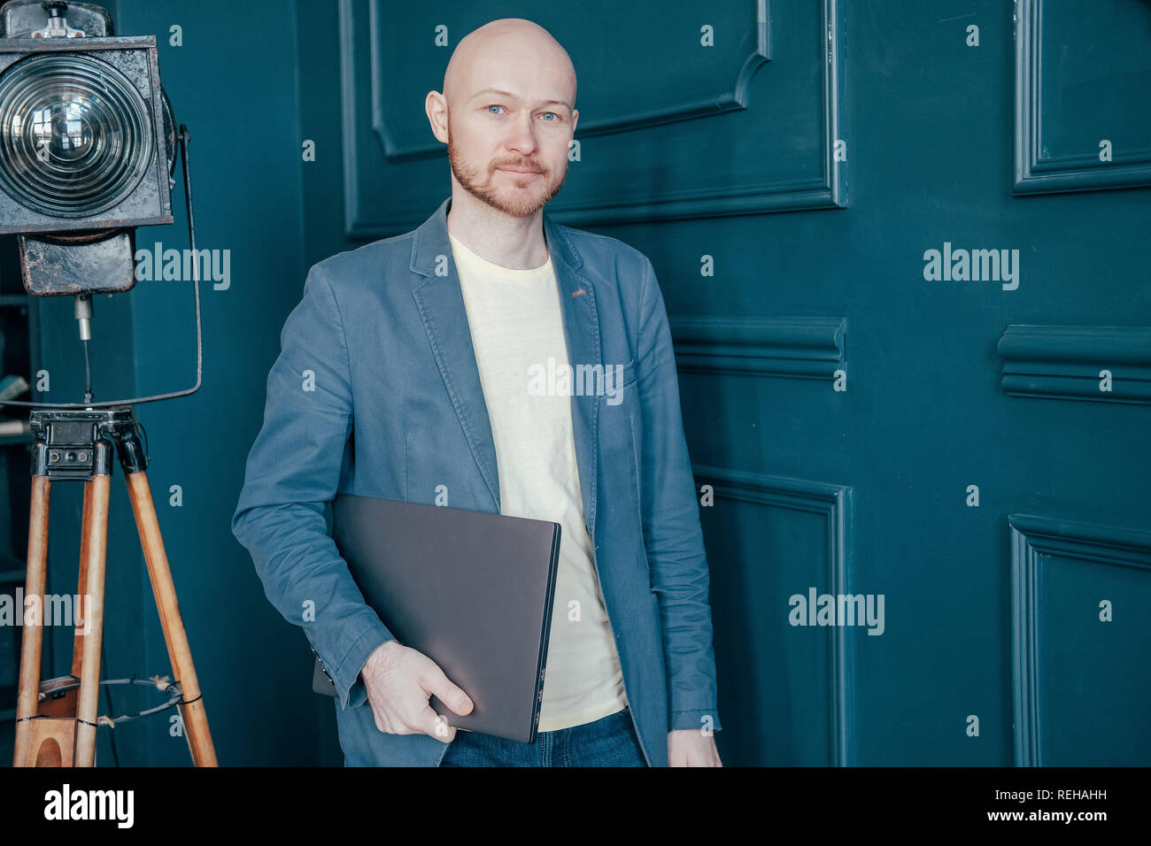 Portrait Of Attractive Adult Successful Bald Bearded Man In Suit With