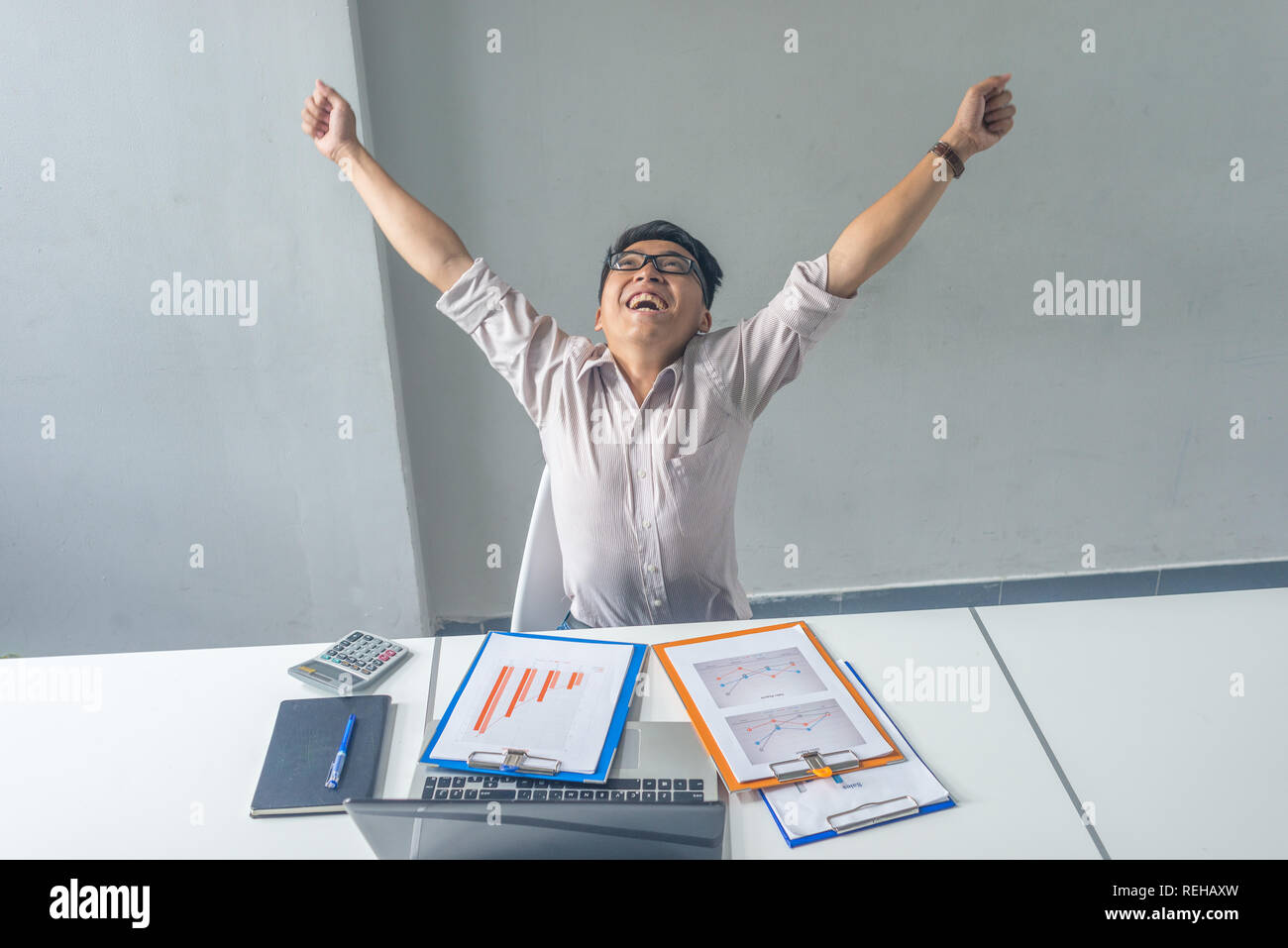 Asian man raising arms hi-res stock photography and images - Alamy