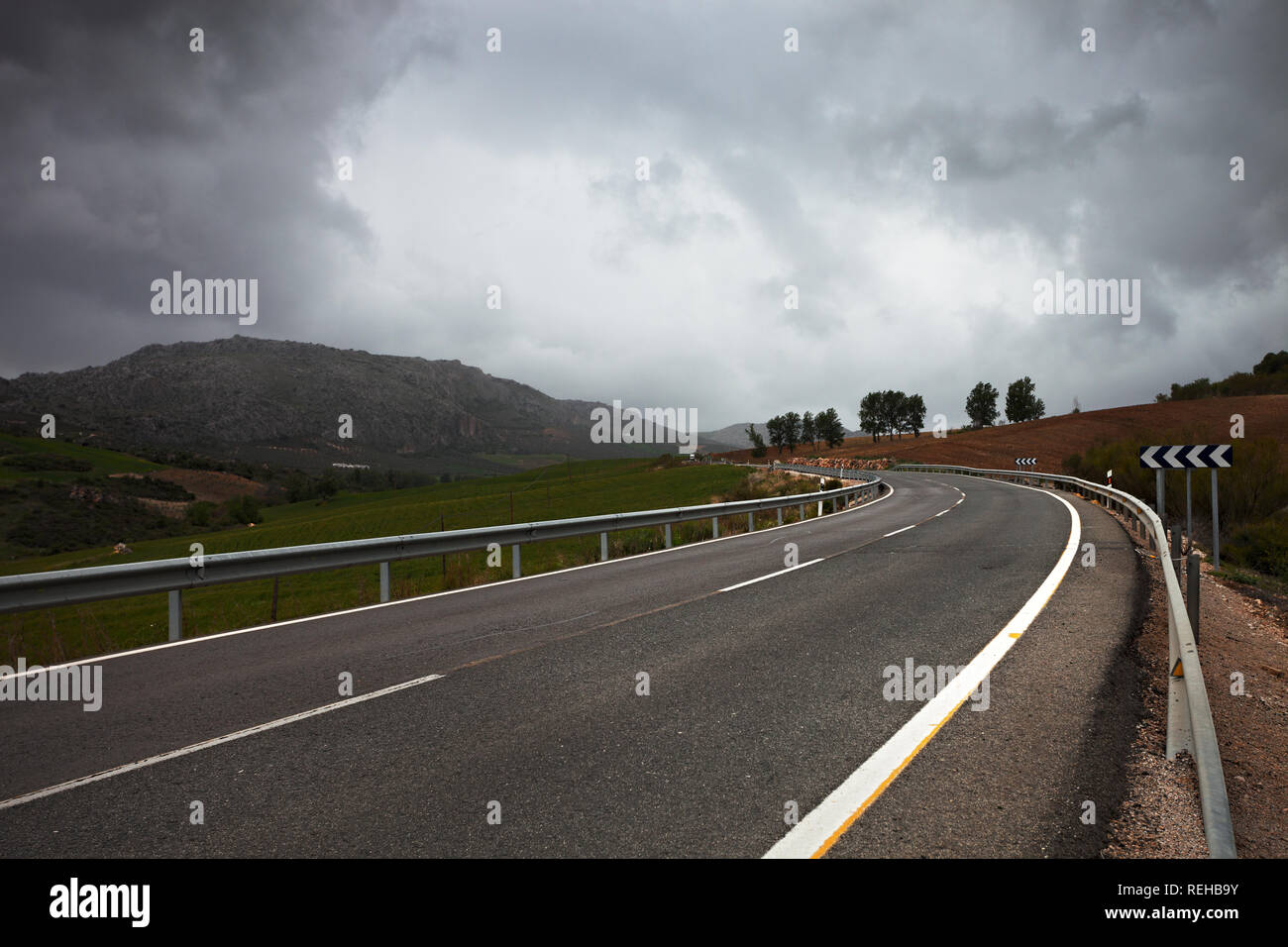 Winding road through hills hi-res stock photography and images - Alamy
