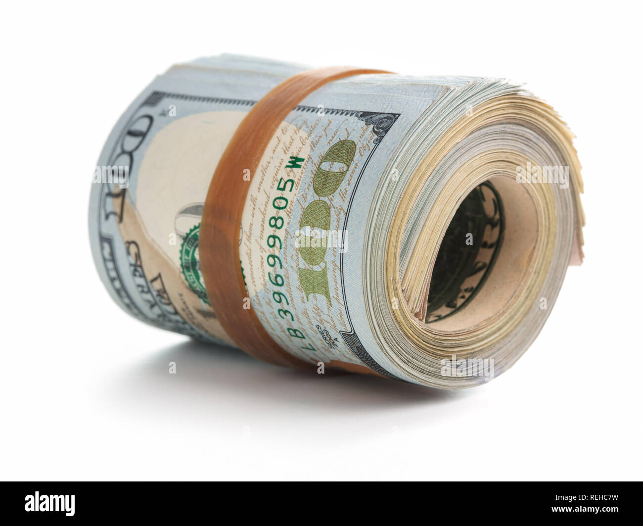 rolled one hundred dollars notes isolated on white background Stock ...