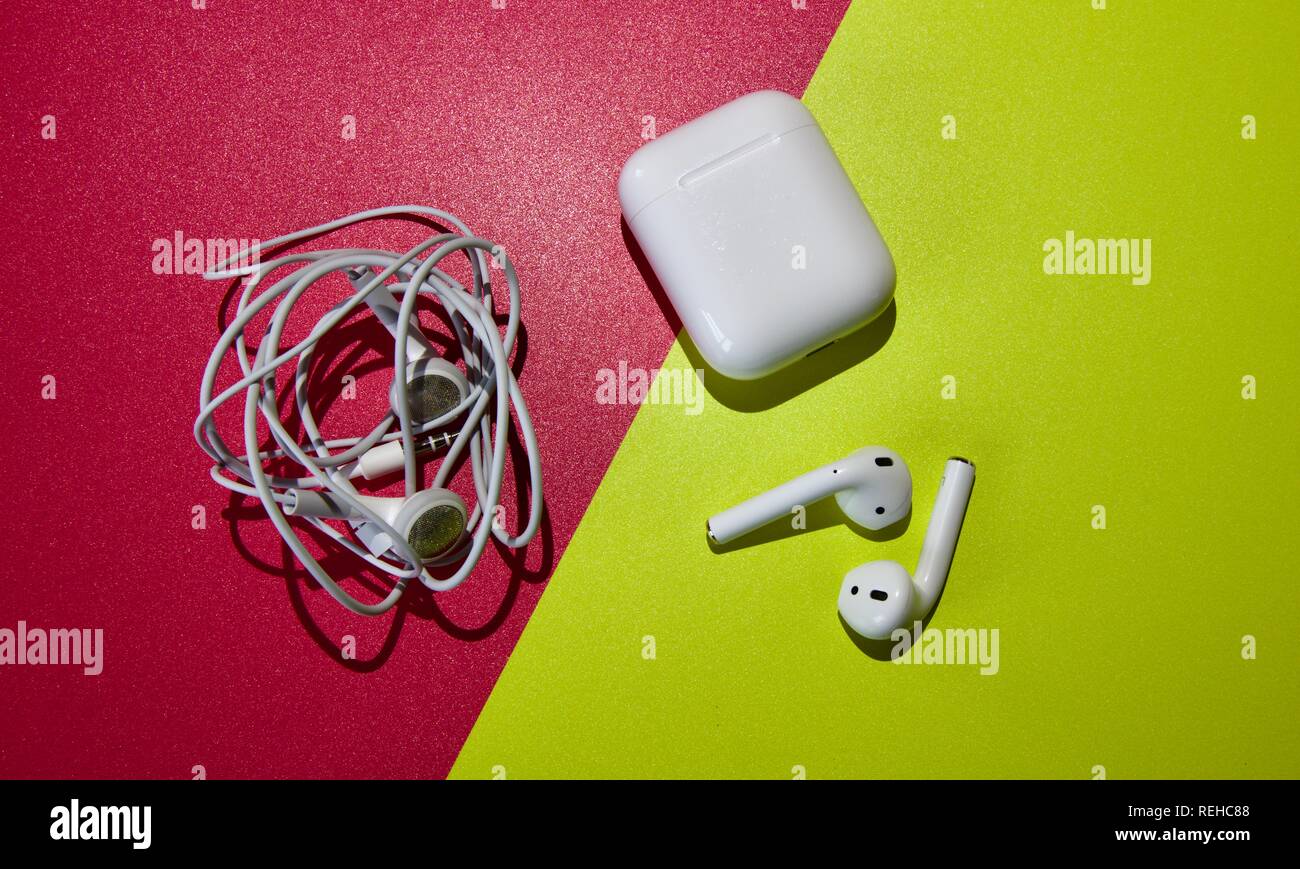 Tangled earbuds and the new wireless AirPods from Apple Stock Photo - Alamy