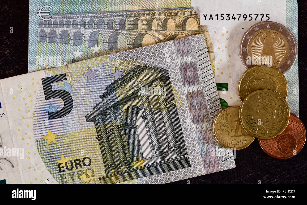 Euro notes and coins Stock Photo - Alamy