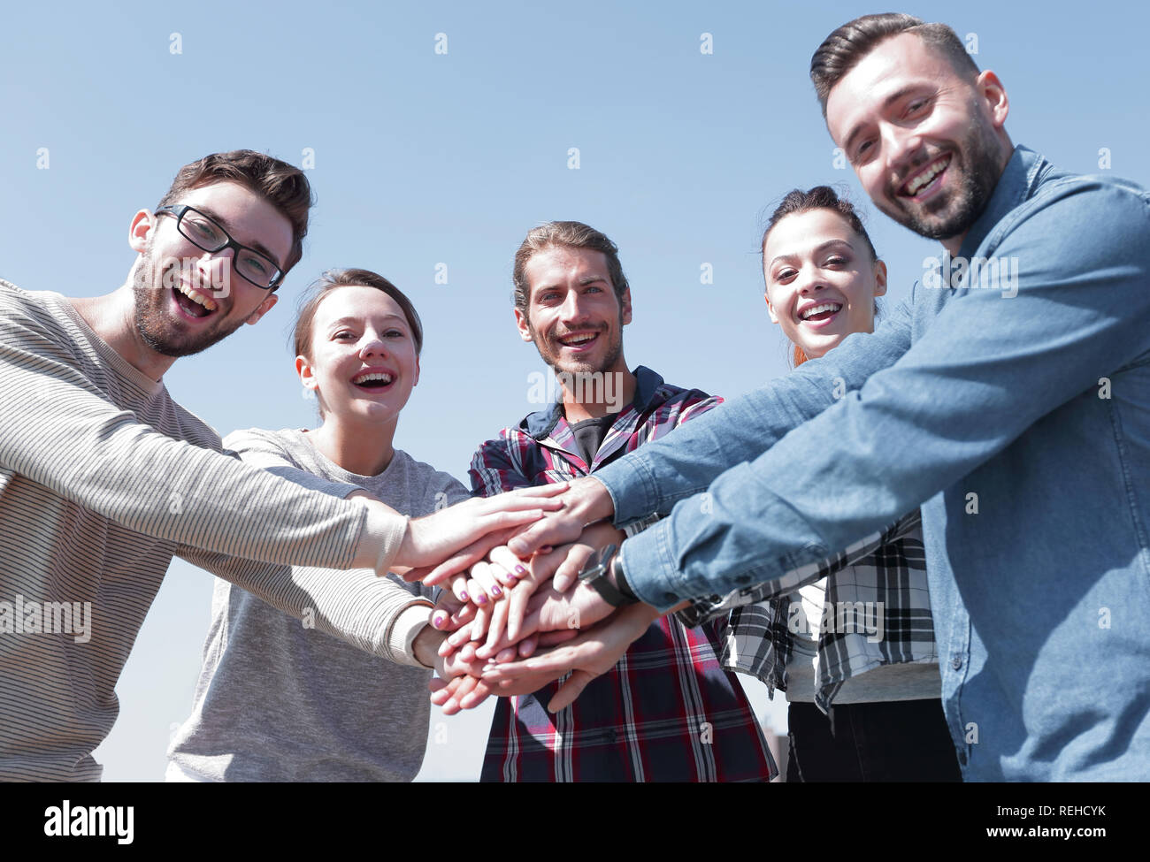 Standing friends joined hands hi-res stock photography and images - Alamy
