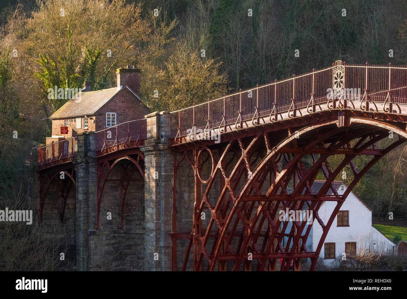Winter sunlight highlights the red colour of the Iron Bridge over the ...