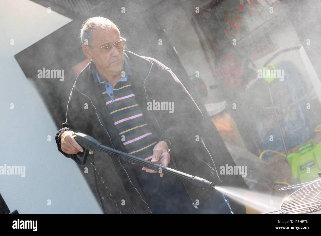 Man using pressure washer hi-res stock photography and images - Alamy