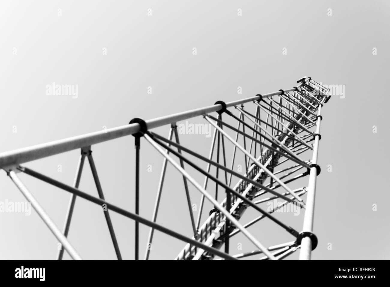 The structure of the metal mast of the telephone tower is seen from the ...