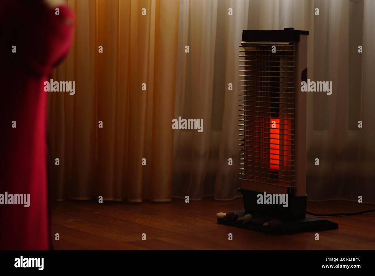 Vintage electric heater Ugolek with a burning lamp rod Stock Photo - Alamy