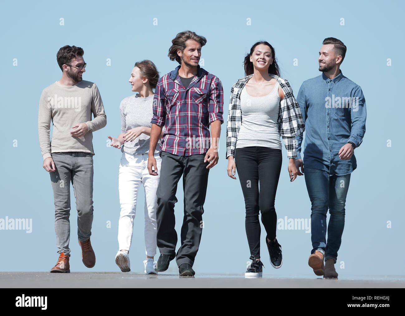 team of young people walking along the road.outdoors Stock Photo - Alamy