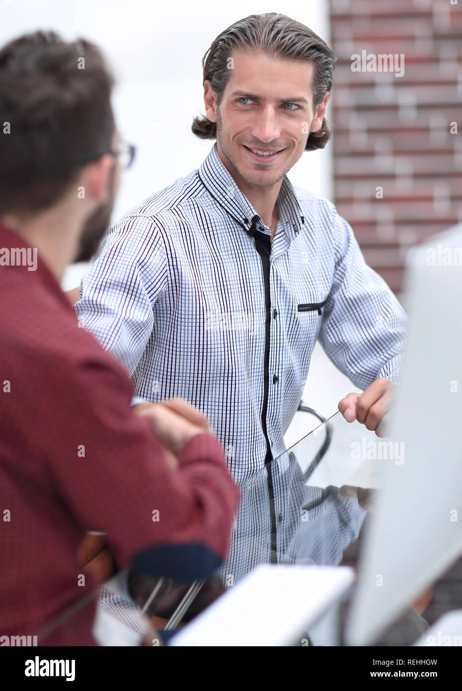 Two men handshake in the office Stock Photo - Alamy