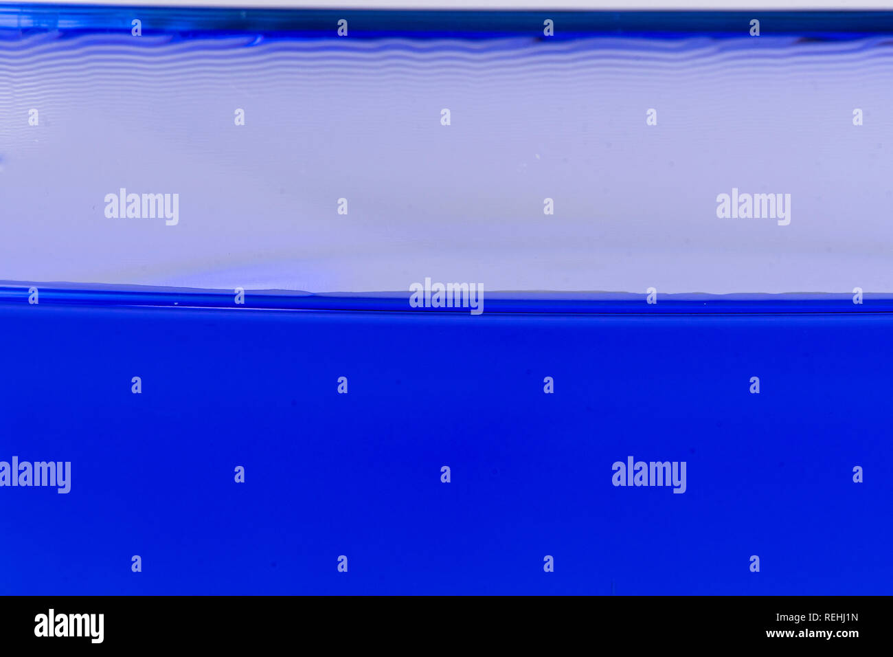 Blue split background with water symmetric Stock Photo - Alamy