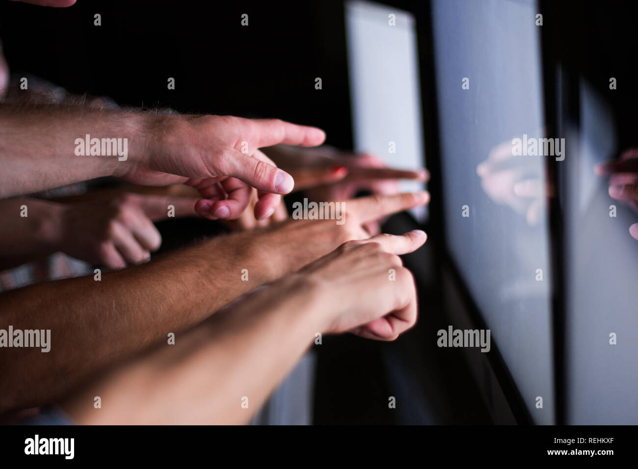 business team pointing their fingers at the computer screen Stock Photo ...