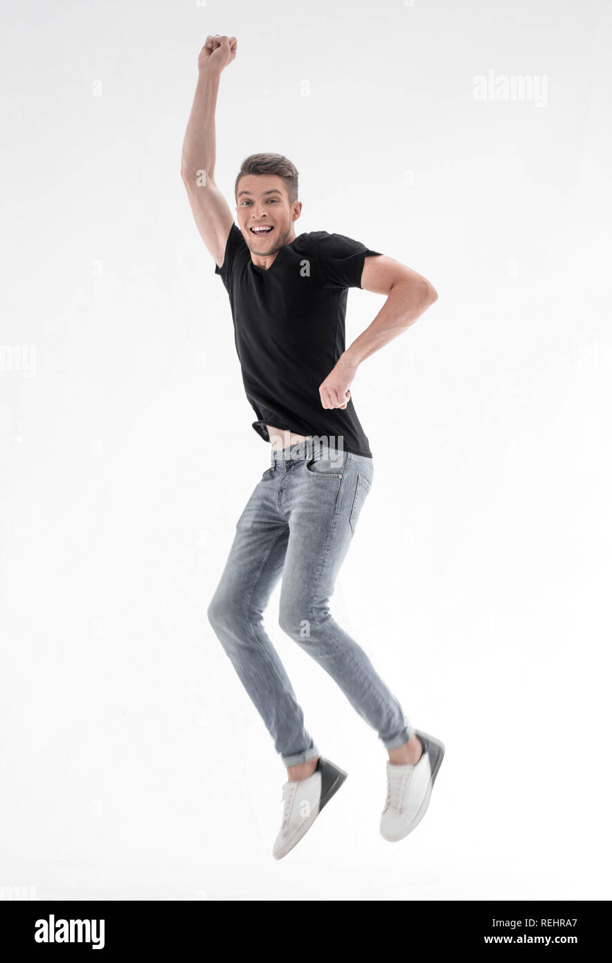 Handsome man jumping Stock Photo - Alamy