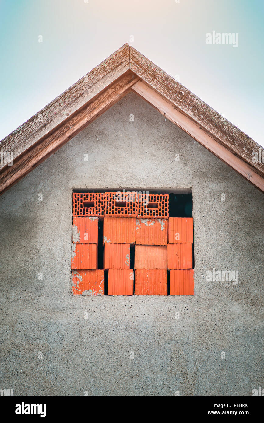 Windows blocked with bricks Stock Photo - Alamy