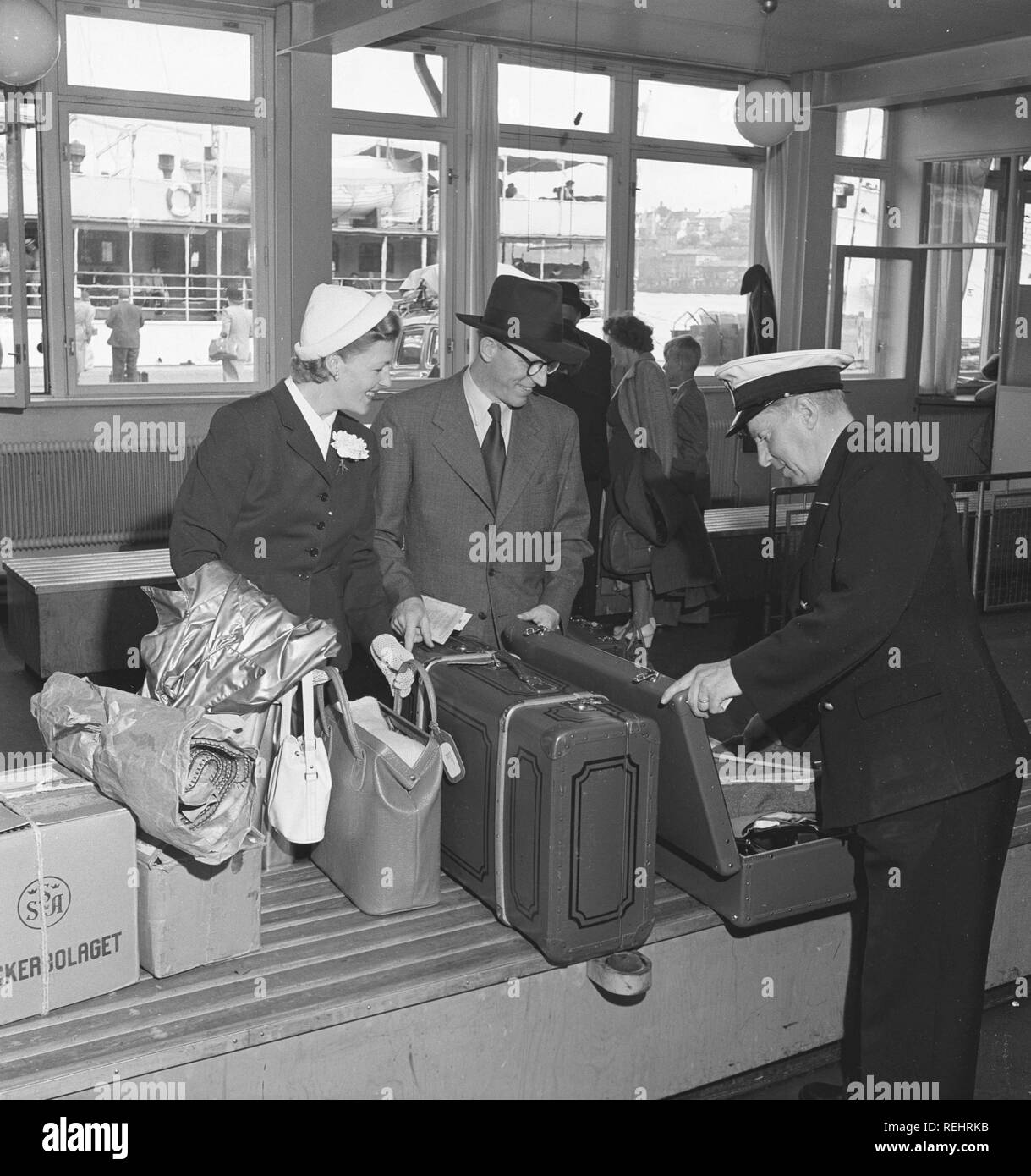 Couple in the 1950s. A couple arriving from a passanger ship tour. A ...