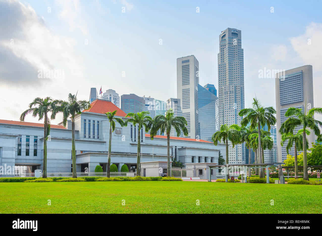 Singapore government building by green lawn, modern cityscape in ...