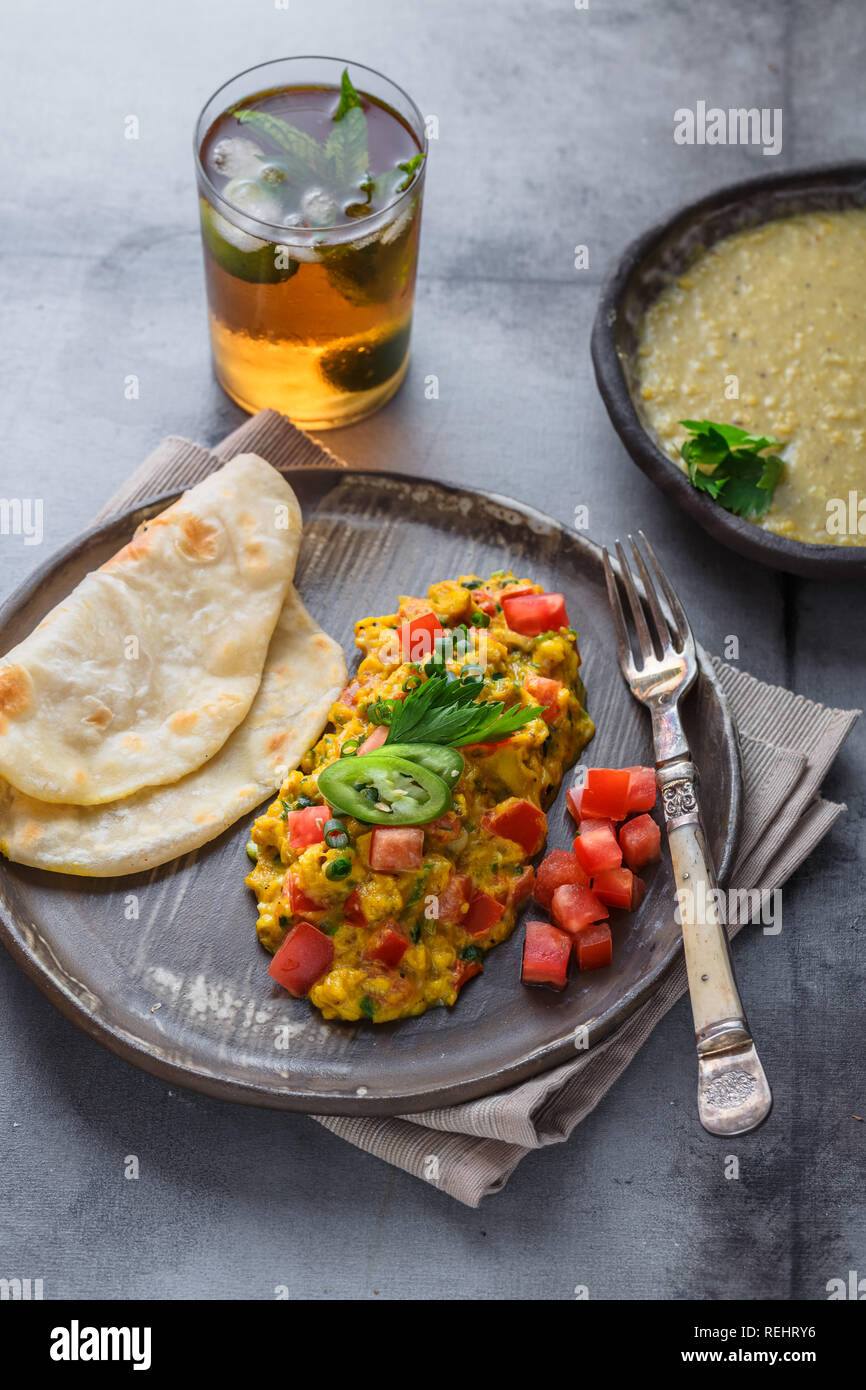 Akoori parsi style scrambled eggs with paratha Stock Photo - Alamy