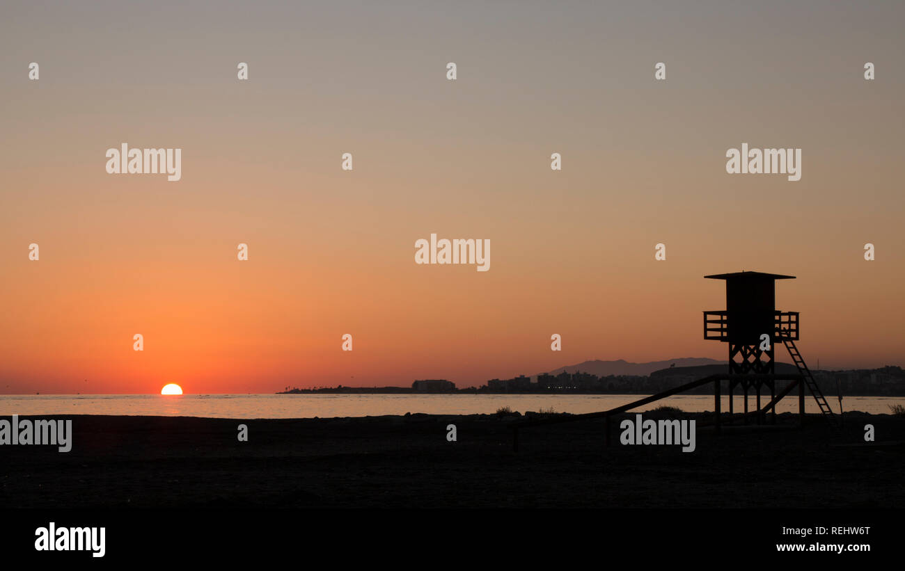 A Spanish lifeguard station with a sunset over the Mediterranean Stock ...
