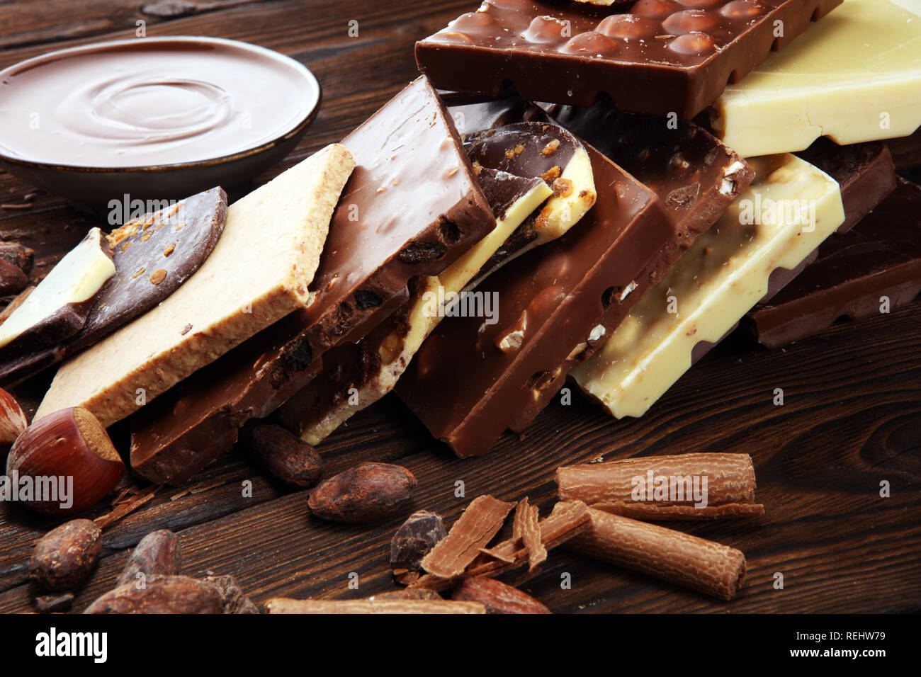 Chocolate bars on table with chocolate tower. Chocolate and nuts and ...
