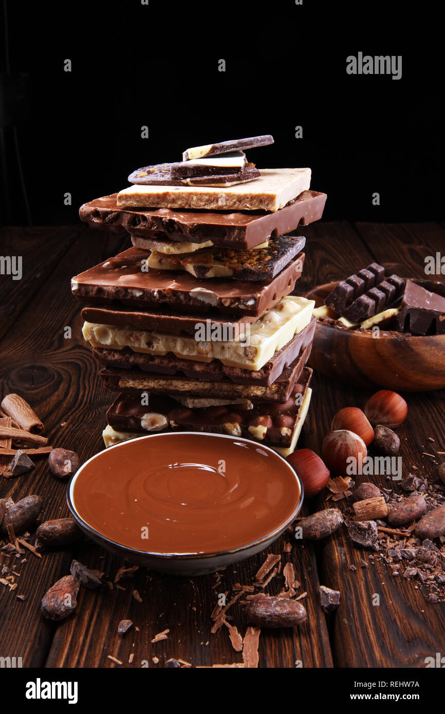 Chocolate bars on table with chocolate tower. Chocolate and nuts and ...