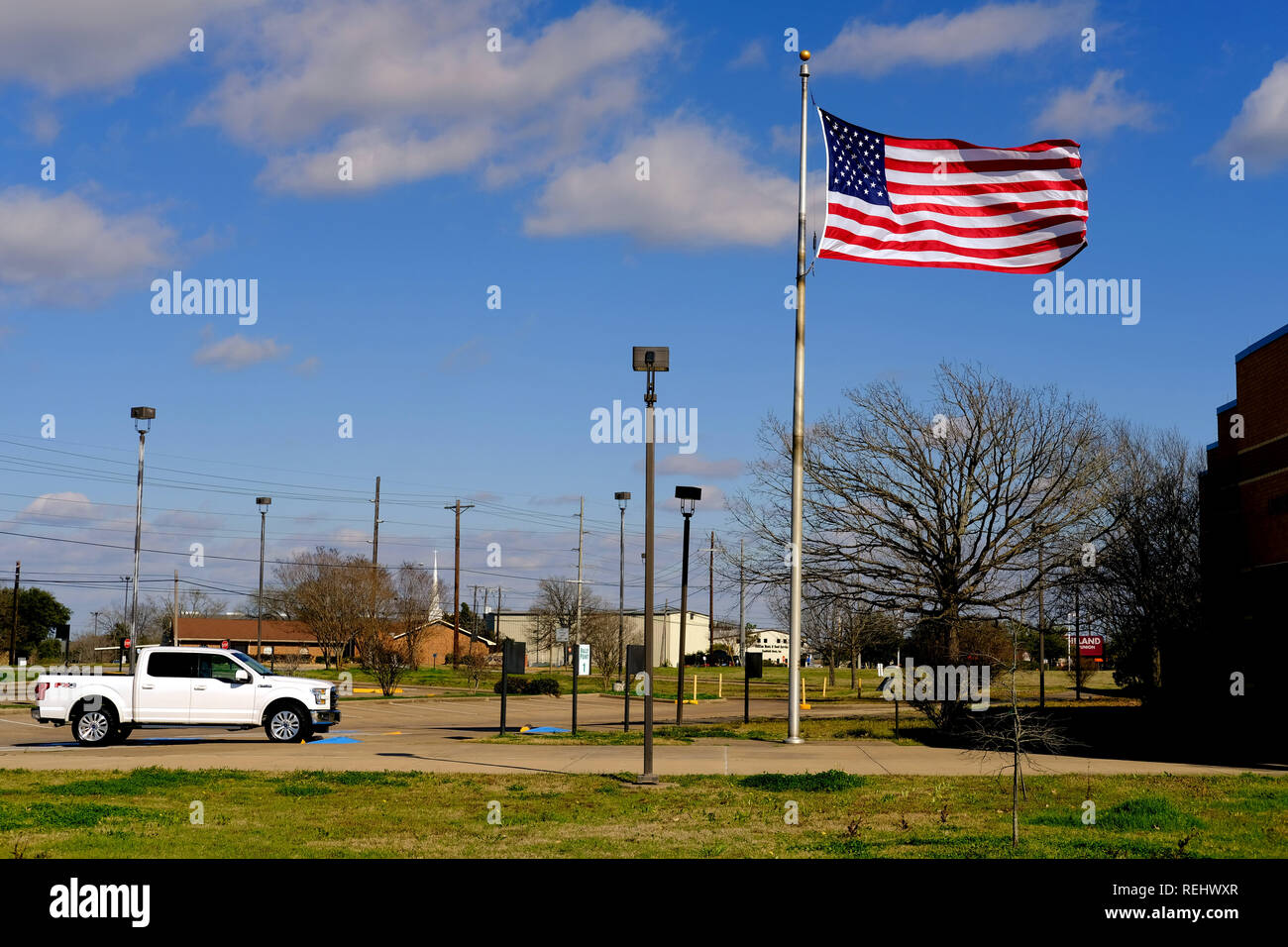 American flag outside the Bryan, Texas, USA post office; flag waving in ...