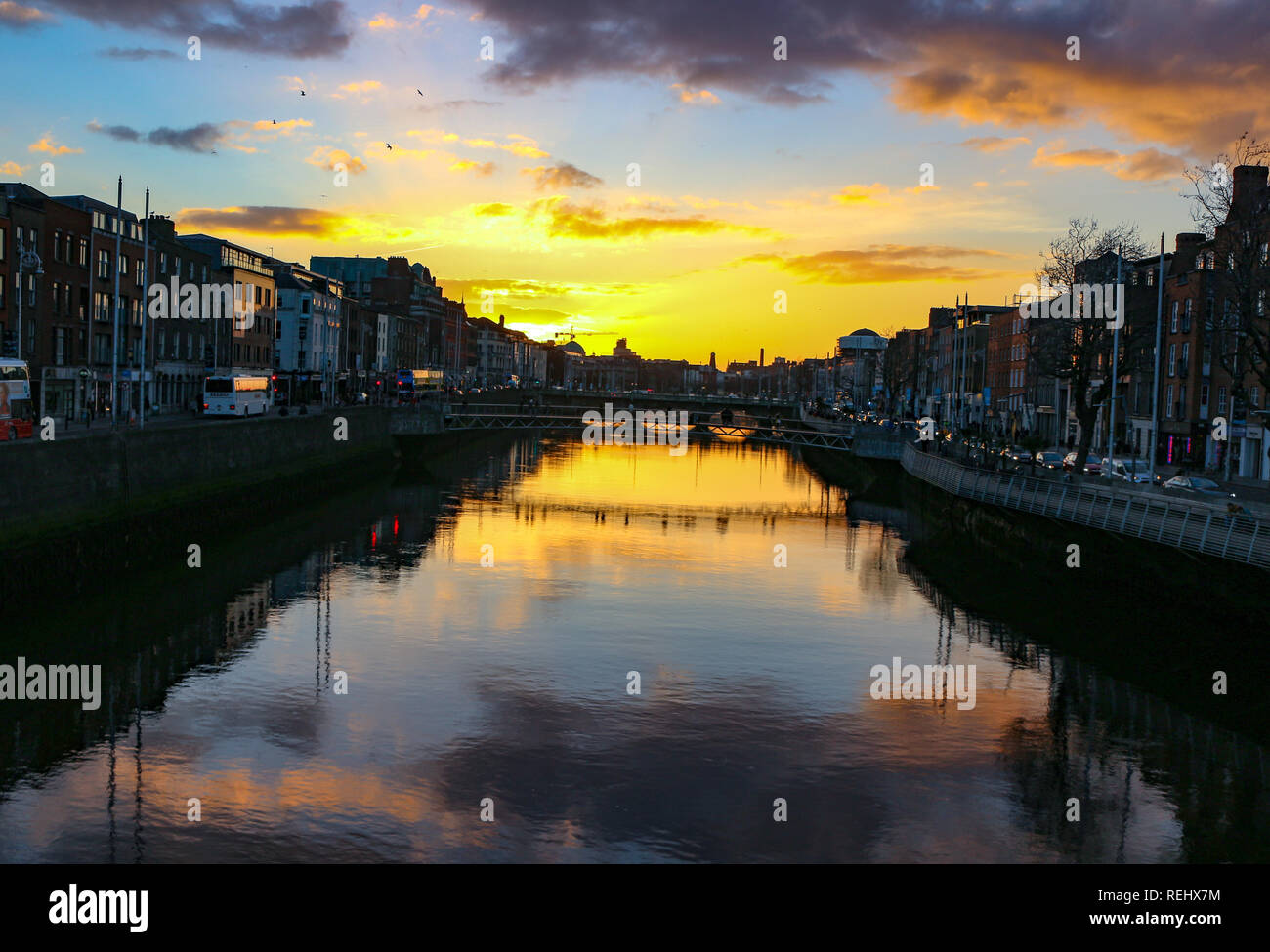 Dublin night scene with Ha'penny bridge and Liffey river lights ...