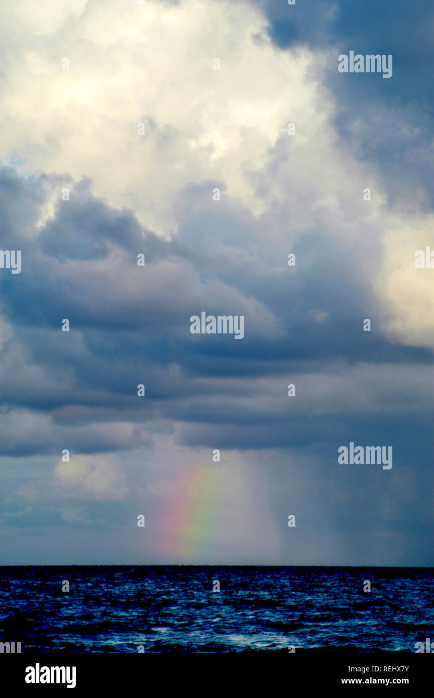 Thunderstorm Over the Atlantic Ocean at Sunset creating a Prism Stock ...