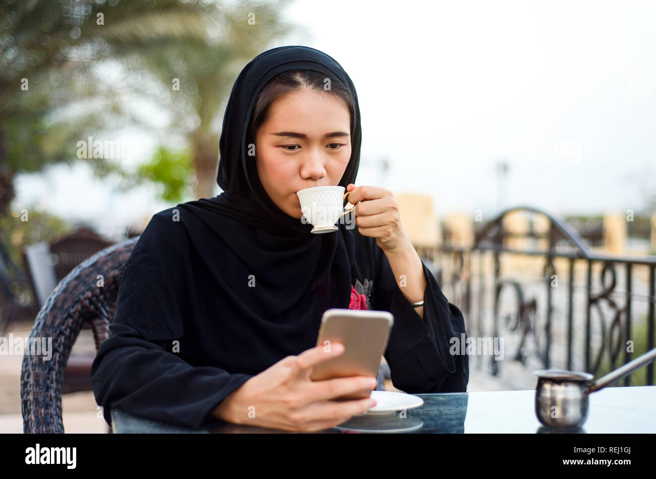 Arab woman drinking coffee in hi-res stock photography and images - Alamy