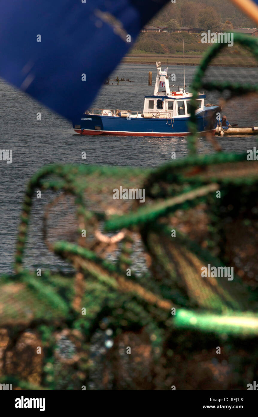 Fishing boat moored on the River Coquet, Amble, Northumberland Stock ...