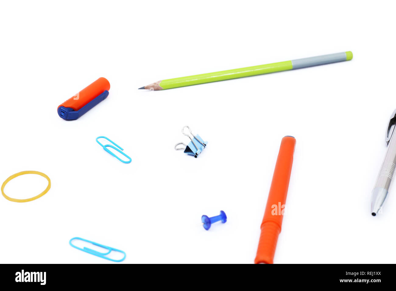 Picture of pen, pencil and paper clip. Isolated on the white background ...