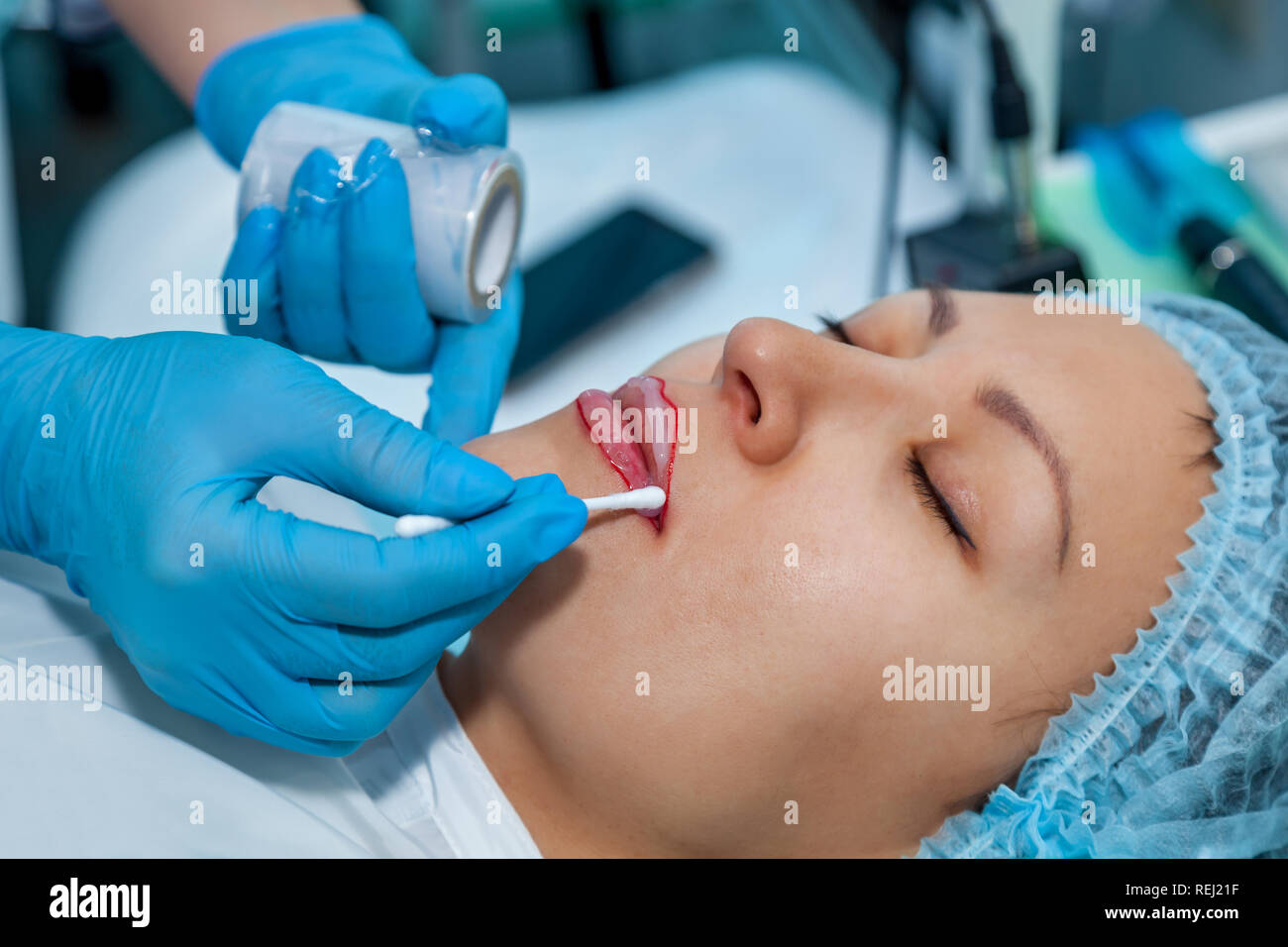 Beautician, anesthesia on the lips for permanent lip makeup. Lip tattoo ...