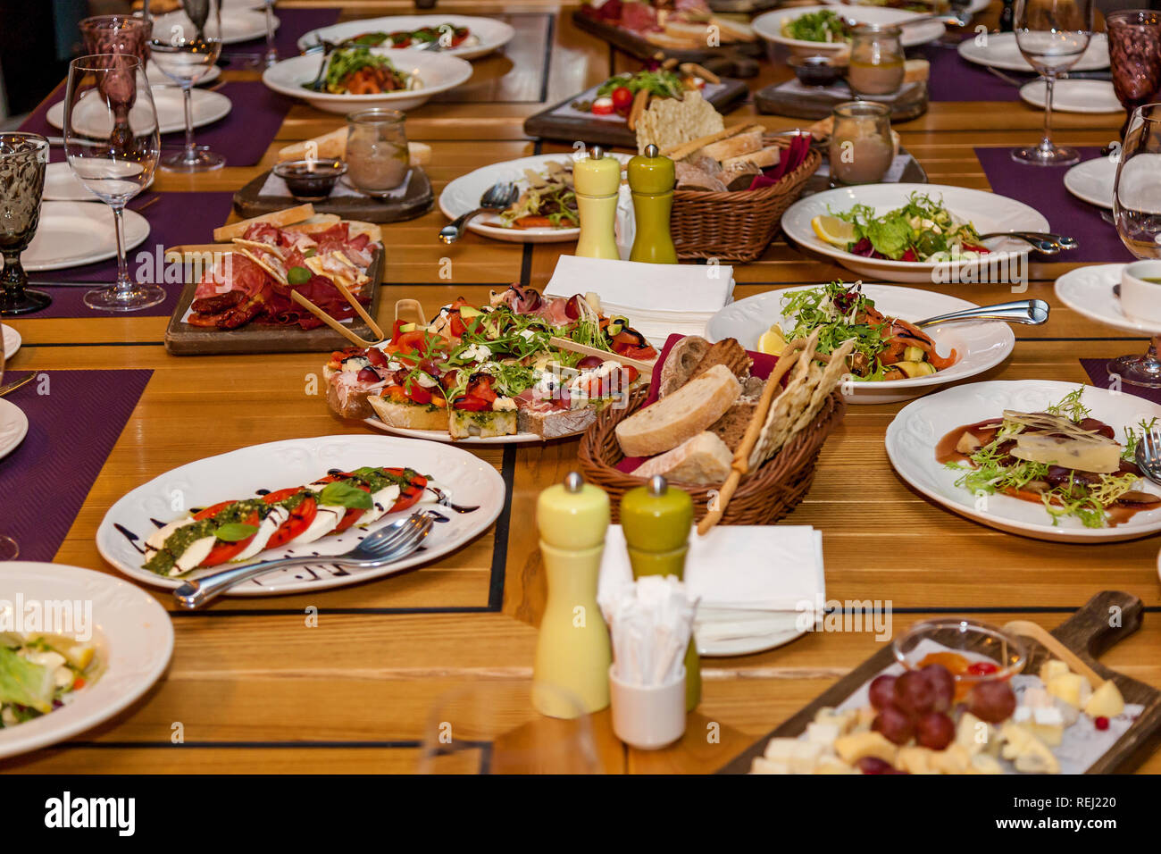 Different dishes and snacks on the holiday table Stock Photo - Alamy