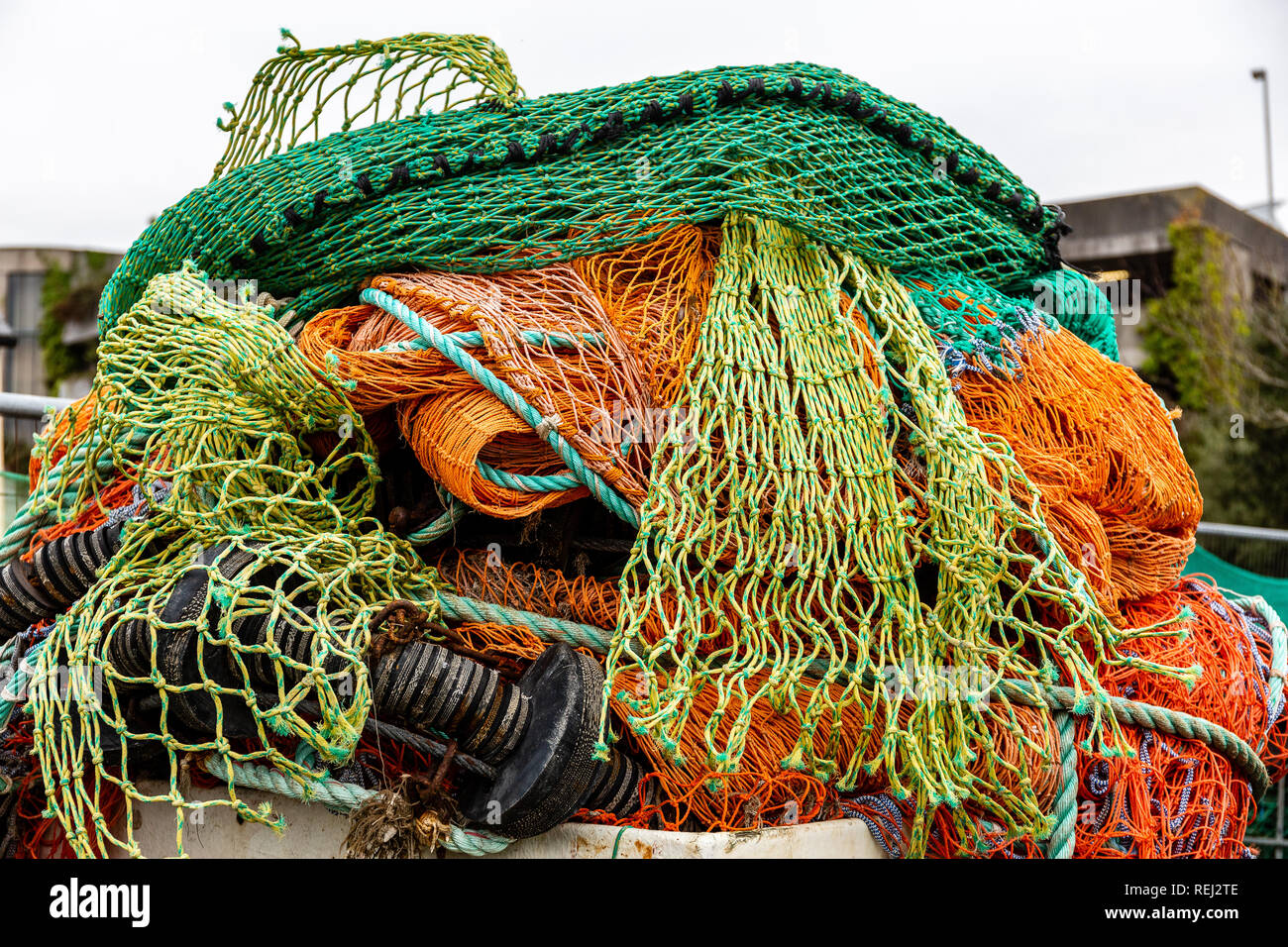 Fishing Nets, rope and gear stacked on Quayside off fishing trawlers ...