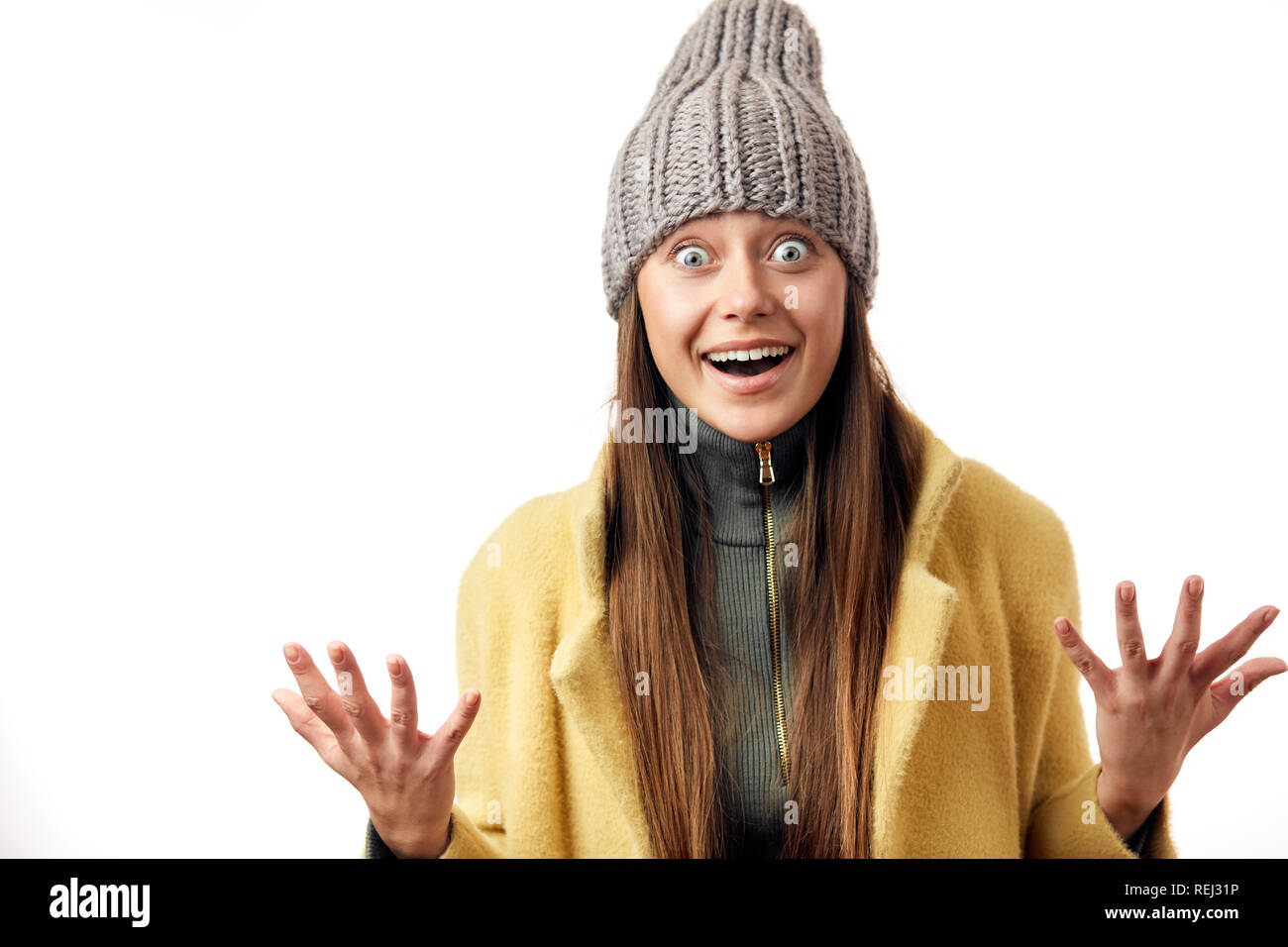 Beautiful bug eyed woman expresses happy emotions, has broad pleasant ...